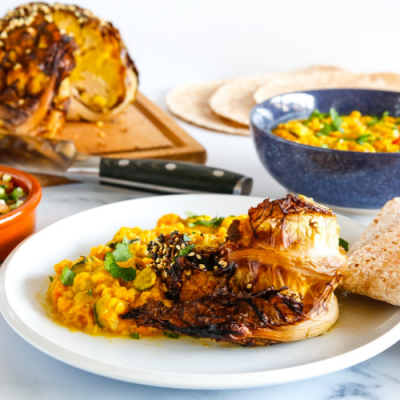 Whole baked spiced cauliflower with courgette and squash dhal ...